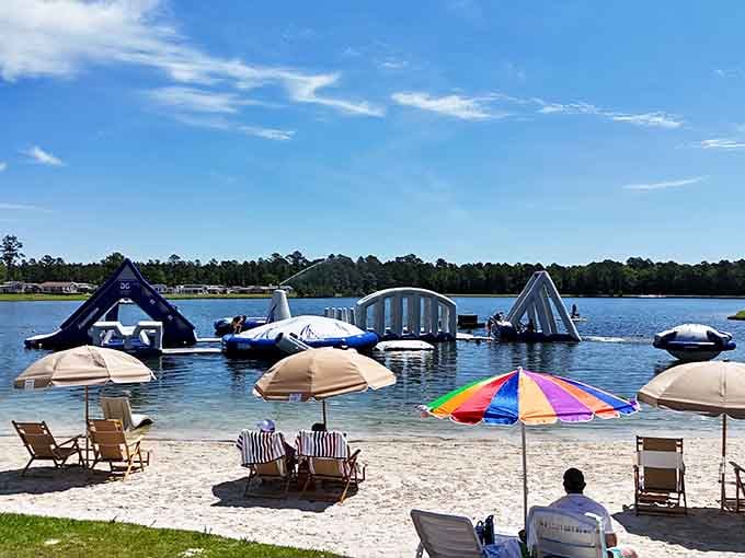 Sandy shores, colorful umbrellas, and an inflatable aqua park that makes you forget the beach is even an option nearby.
