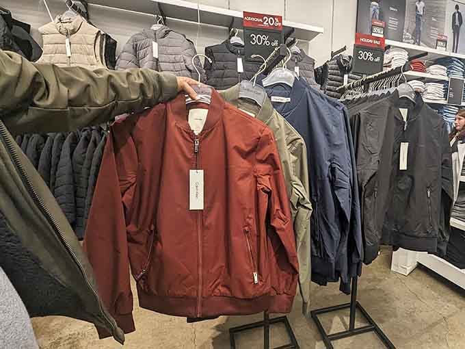 Calvin Klein jackets lined up like a well-dressed army, all waiting to join your wardrobe at outlet prices.
