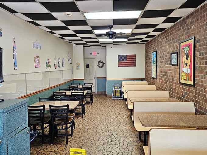That checkerboard ceiling and Yogi Bear artwork make this dining room feel like a delicious trip back in time.