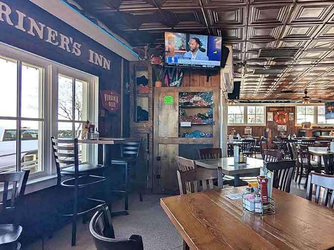 Tin ceiling tiles and wooden beams create that authentic pub atmosphere where everyone feels like a regular immediately.