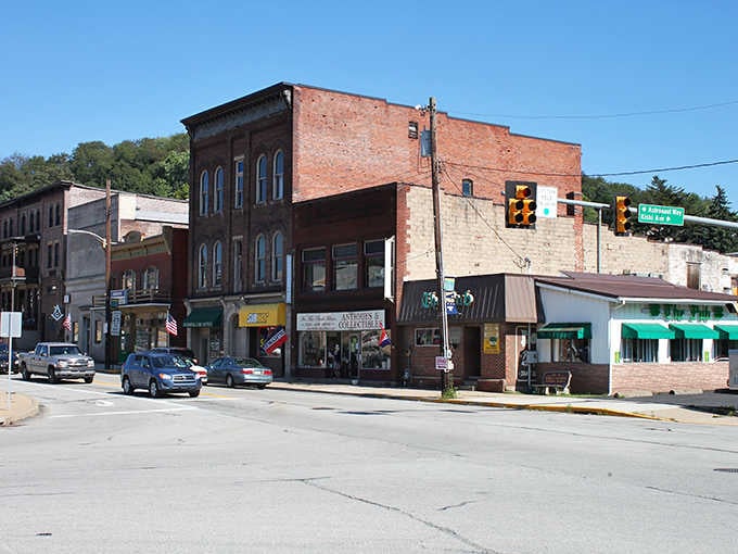 Brick buildings wear their age like badges of honor, standing proud along streets that remember simpler times.
