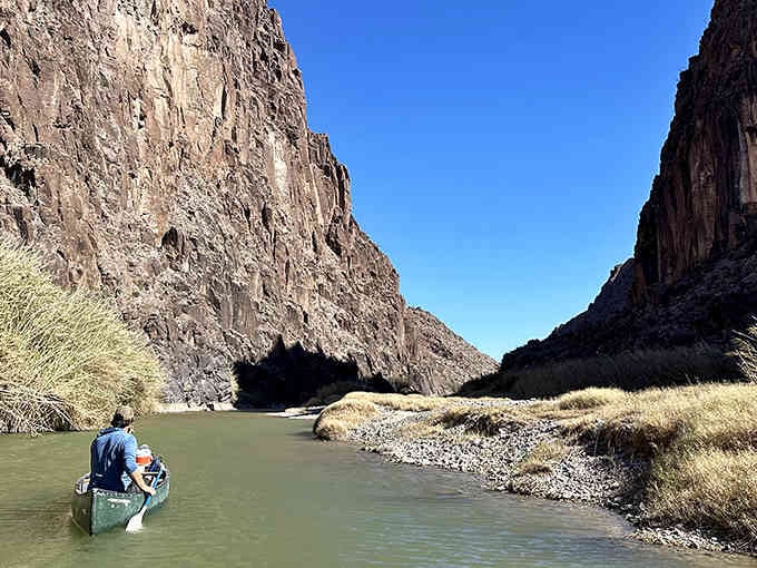 Paddling through towering canyon walls feels like traveling back to when dinosaurs roamed—minus the dinosaurs, thankfully.