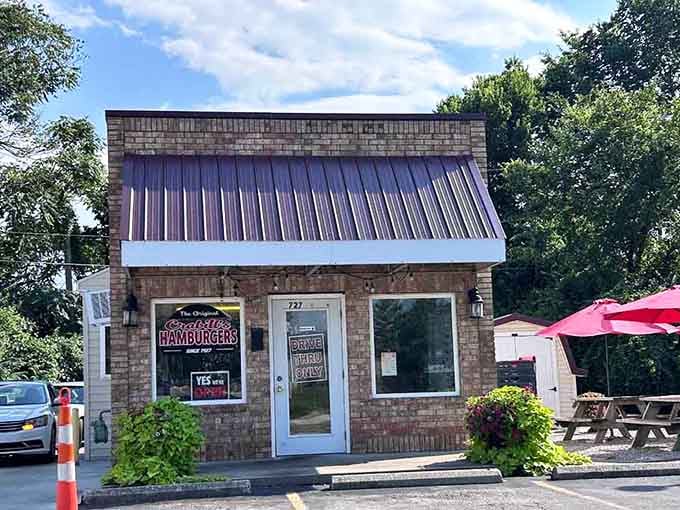 That cheerful "Yes We're Open" sign on a sunny brick wall is basically the best news you'll read all day.