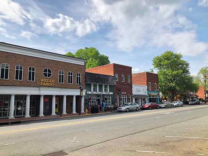 The Village Store sign says it all, Davidson's Main Street is the kind of place where neighbors actually stop and chat.