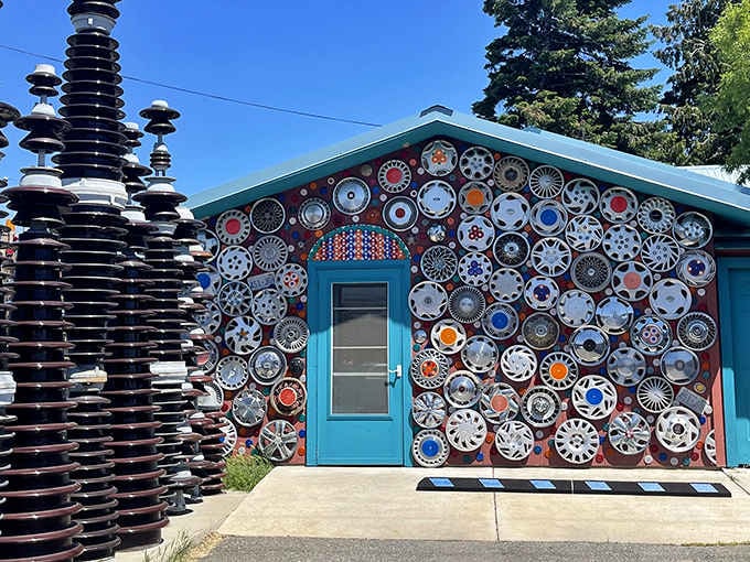 Hundreds of hubcaps gleam in the Ellensburg sunshine, turning one small house into a dazzling, spinning gallery.