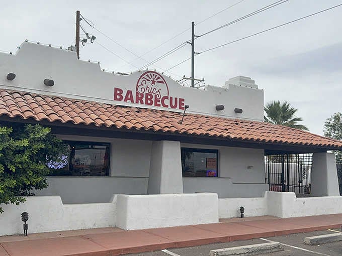 This charming white adobe building with terra cotta roof tiles whispers "authentic BBQ" in the most unassuming way possible.