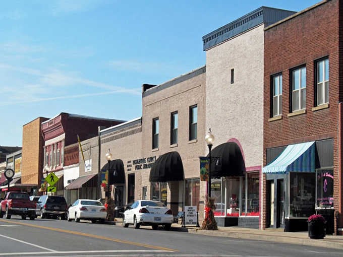 Colorful awnings and vintage architecture remind you that some things get better with time, like fine bourbon and small-town charm.