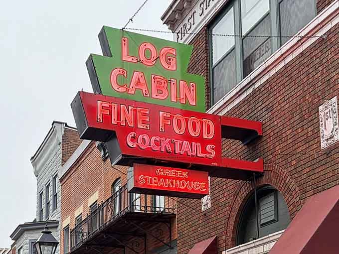 Bold red and green letters stacked against Galena's brick skyline, promising fine food, cocktails, and a Greek twist nobody saw coming.