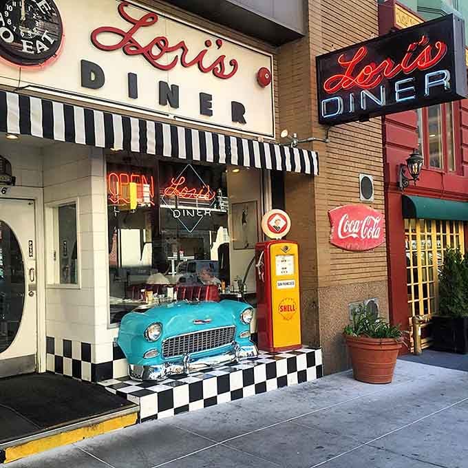 A teal classic car parked on checkered tiles outside Lori's is the most delightful sidewalk decoration in all of San Francisco.