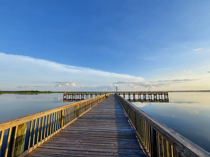 Meaher's boardwalk pier mirrors a sky so blue and vast it feels almost too good to be real.