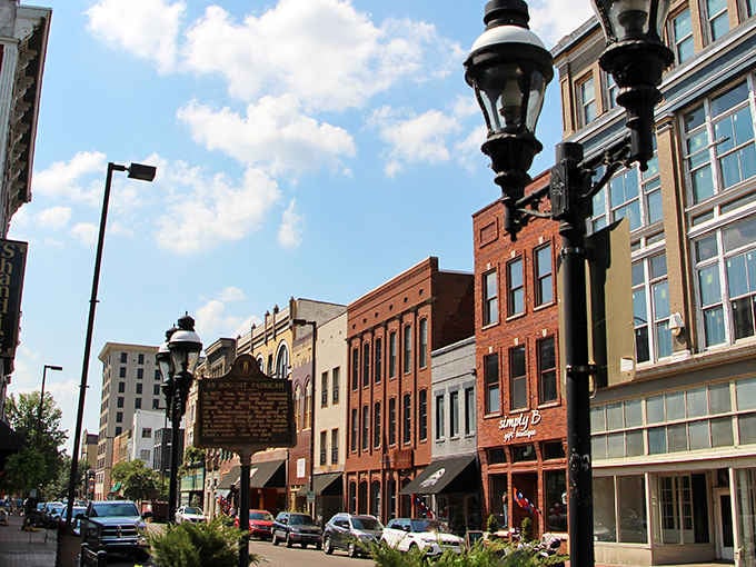 Historic lampposts frame your sunny day stroll past the charming brick storefronts lining the lovely, vibrant streets of Paducah.