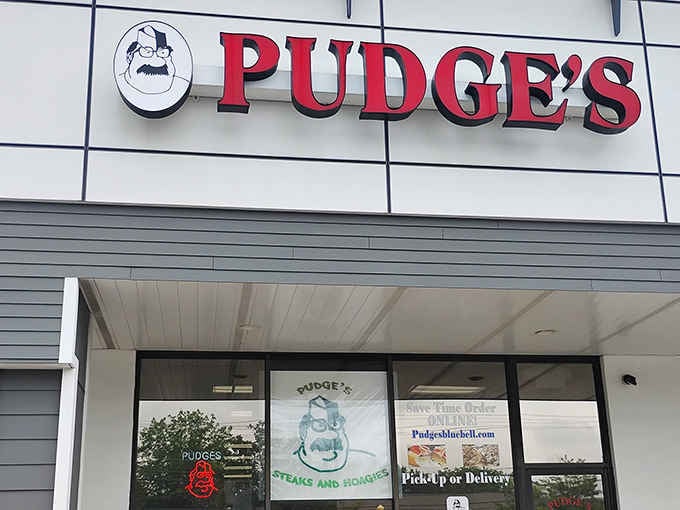 Bold red letters and a cartoon mascot that practically dares you to walk in and order the biggest cheesesteak of your life.