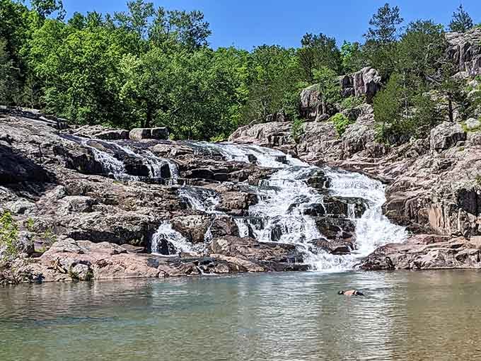 Water dancing over pink granite in multiple tiers creates nature's own staircase to paradise.