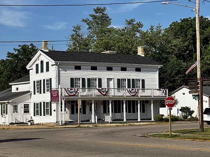 Patriotic bunting and a welcoming porch make this classic white building look like Main Street, USA personified.
