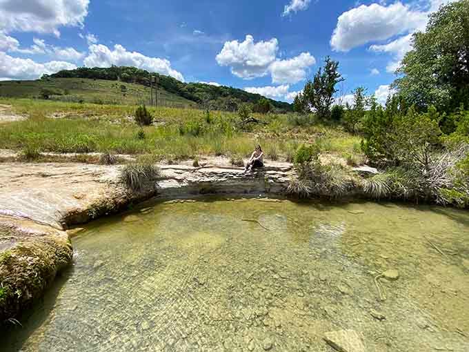Crystal-clear water pools over smooth limestone at Balcones Canyonlands, where Hill Country reminds you it's been beautiful long before you arrived.