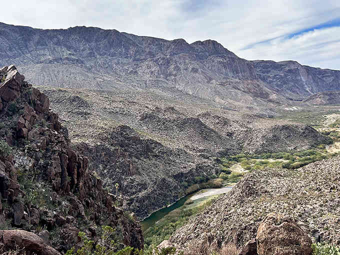 The river winds through ancient rock formations that have been standing guard here for millions of years.