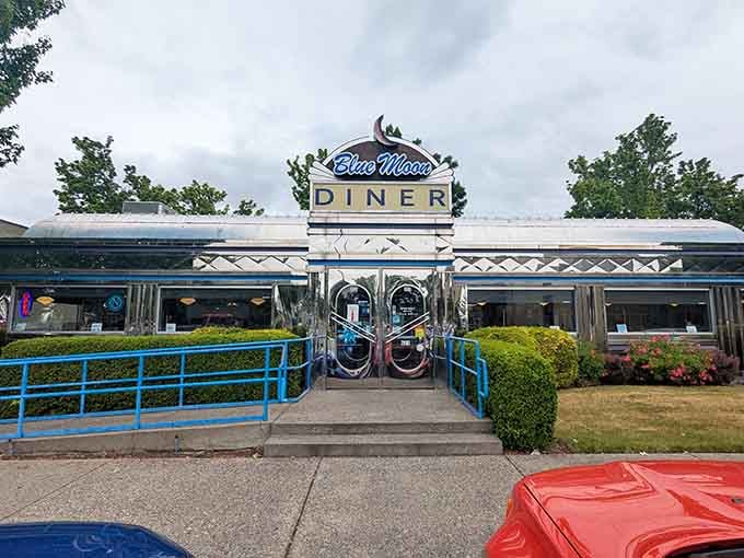 Even under cloudy skies, those polished chrome panels and bold signage make the Blue Moon Diner impossible to ignore or resist.