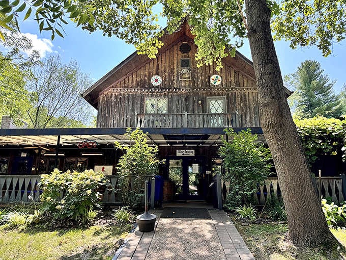That "Wine Tasting" sign beckoning through Blumenhof's lush entrance is basically an irresistible personal invitation.