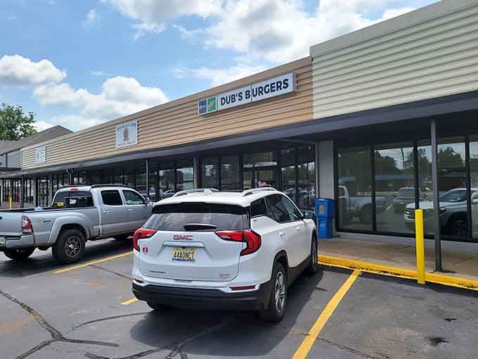 A full parking lot under puffy clouds tells you everything you need to know about how Athens feels about Dub's Burgers.