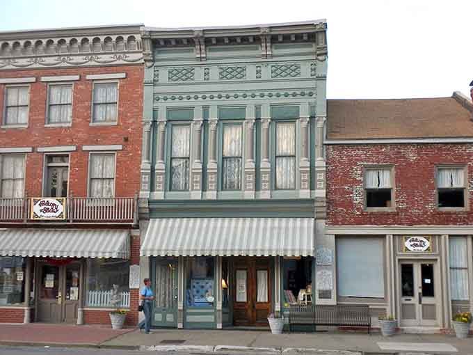 That ornate sage-green Victorian facade in Hannibal is the architectural equivalent of a perfectly tailored suit, timeless and impressive.