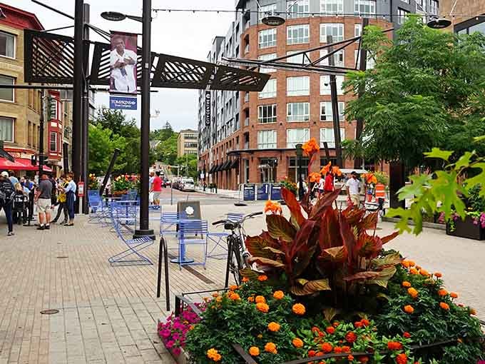 Vibrant planters burst with color against historic architecture, proving small-town charm never goes out of style here.