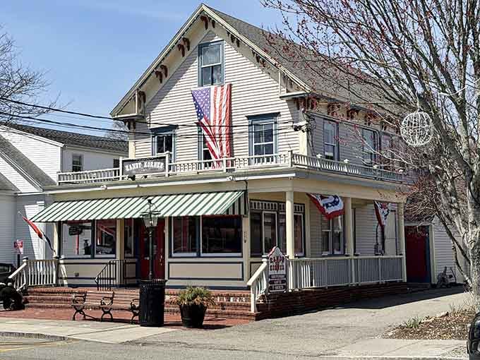Flags flying, benches out front, and a sign promising ice cream &mdash; Kandy Korner is Hyannis at its most charming.