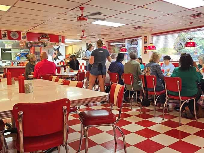 Chrome chairs, ceiling fans spinning lazily overhead, and a dining room buzzing with the beautiful noise of people genuinely enjoying themselves.