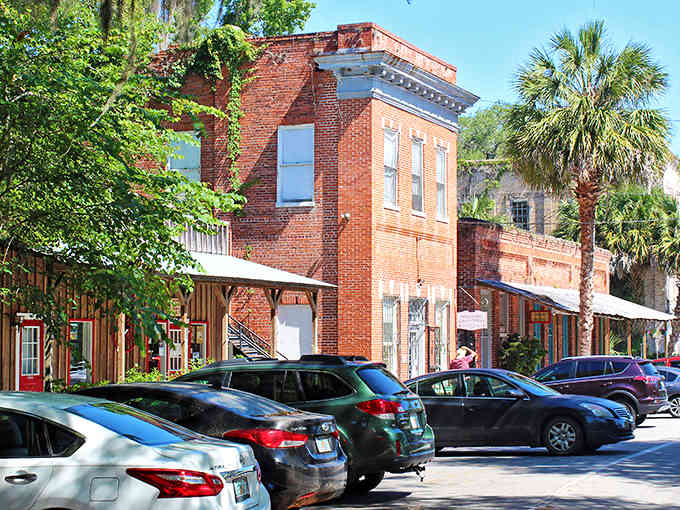 Red brick buildings and palm trees create an unexpected pairing that somehow works beautifully in this old Florida town.