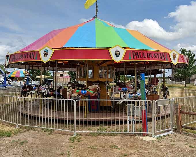 That rainbow-topped Paul Bunyan carousel isn't just a ride, it's a full-on declaration that summer in Brainerd means business.