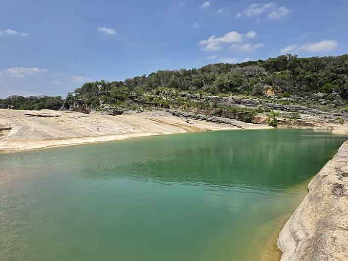 A sweeping green reservoir cradled by rocky bluffs &mdash; this is what postcards wish they looked like.