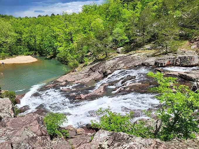 The emerald pool at the base catches every cascade, making this hidden gem worth the journey.