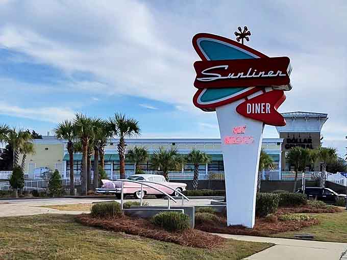 That pink classic car parked out front isn't just decoration; it's a promise of good times inside.