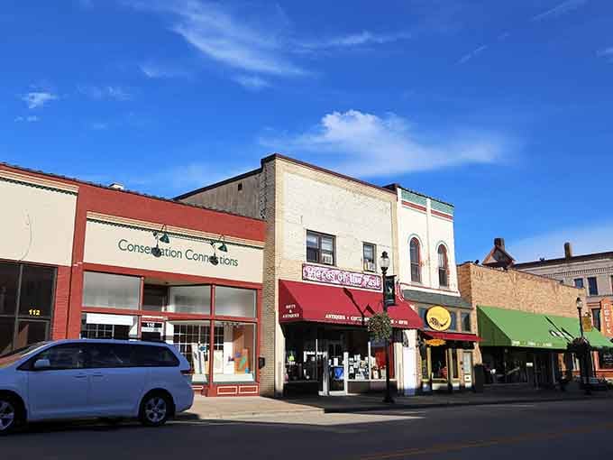 Sunny skies illuminate a downtown where local shops still outnumber chain stores, refreshingly authentic.