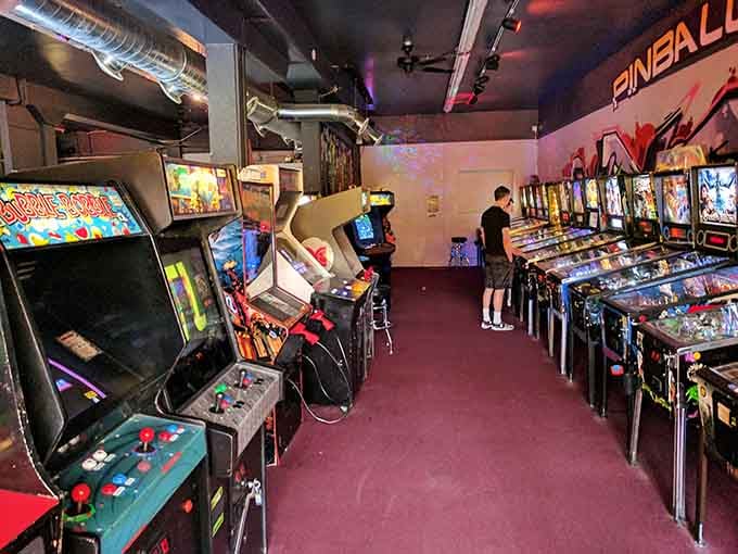The pinball room at 8-Bit Arcade lines up machine after machine like a greatest hits album.
