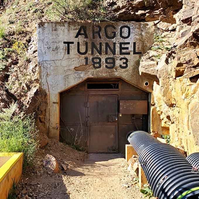 "Argo Tunnel 1893" carved in stone. Some doors lead to rooms, this one leads to an entire era.