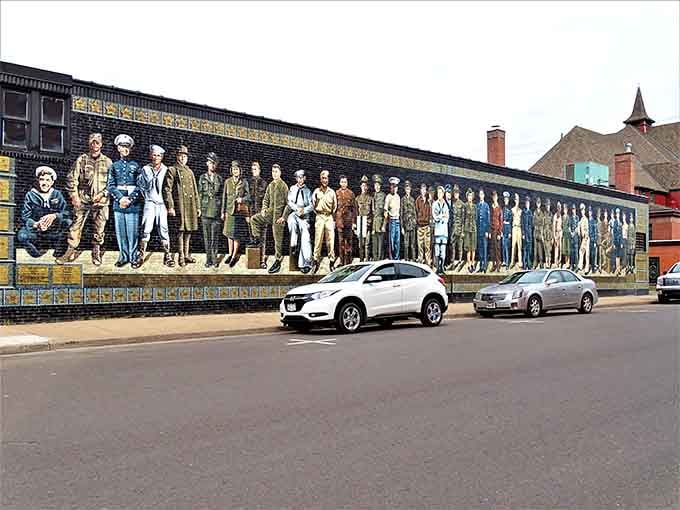 This mural celebrates the faces that built Ashland, turning a simple wall into a powerful history lesson.