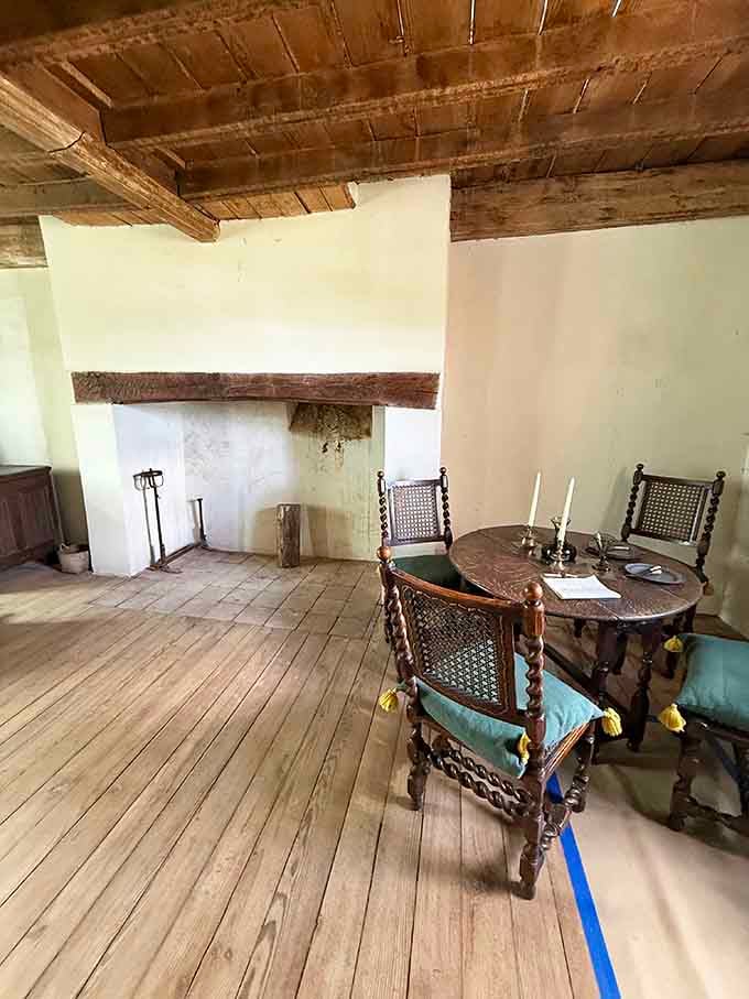 Barley-twist chairs and candlelight at a table where serious 17th-century conversations definitely happened.