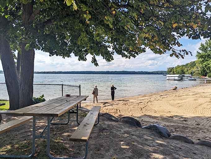 Shade trees and picnic tables create the ultimate outdoor dining room with a million-dollar water view.