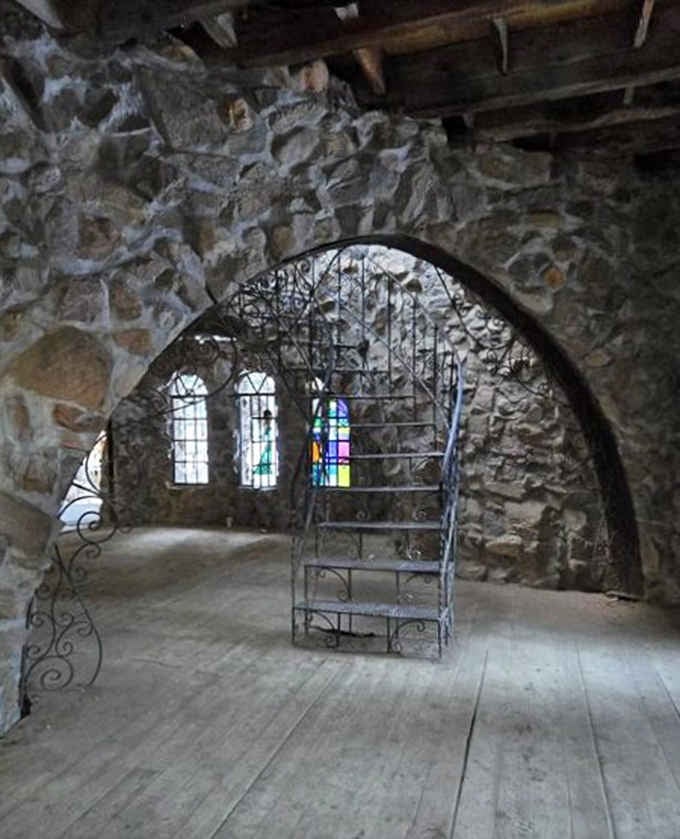 Stained glass windows illuminate stone walls in a ballroom that makes your living room renovation look positively lazy by comparison.