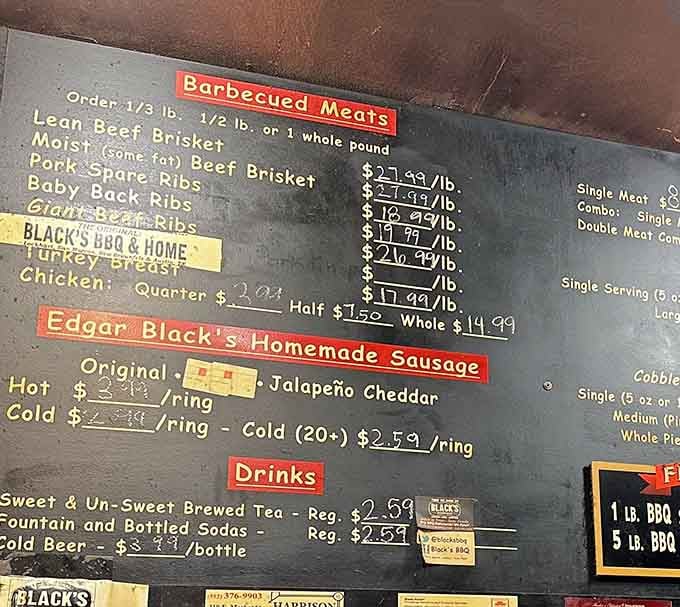 A chalkboard menu this straightforward is basically a love letter written in brisket and homemade sausage.