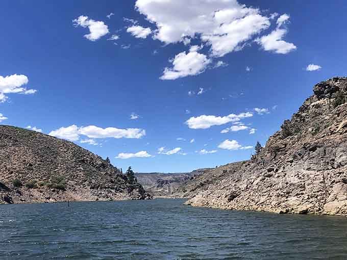 From the water, Blue Mesa's canyon walls rise up and remind you who's boss.