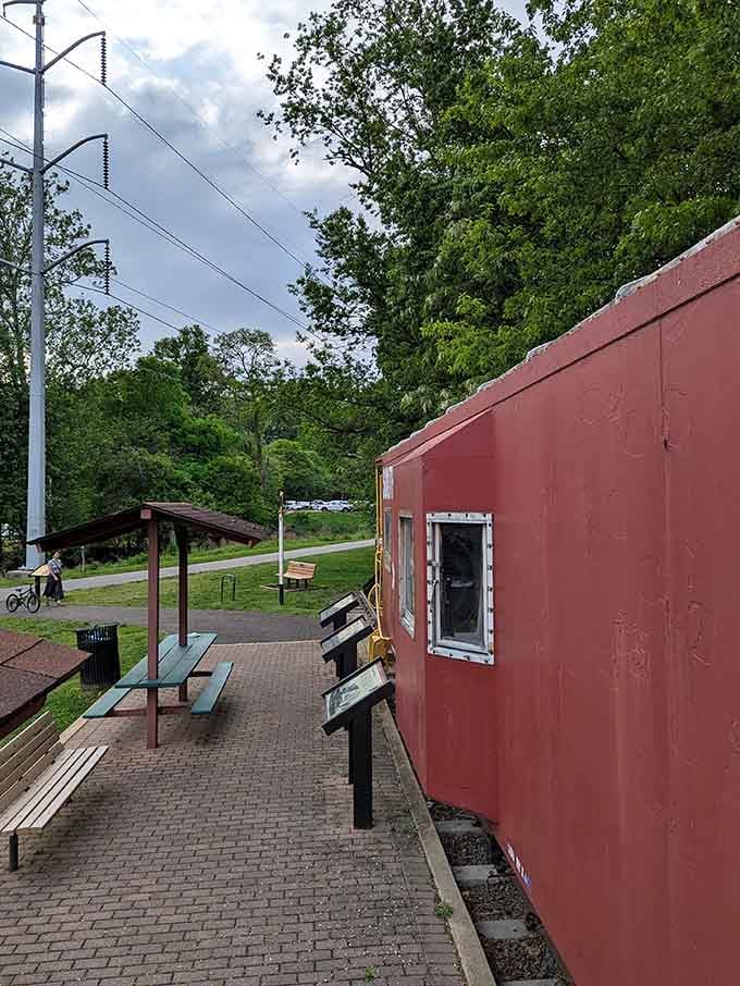 Brick pavement, green benches, and a caboose that's seen more history than most textbooks ever covered.