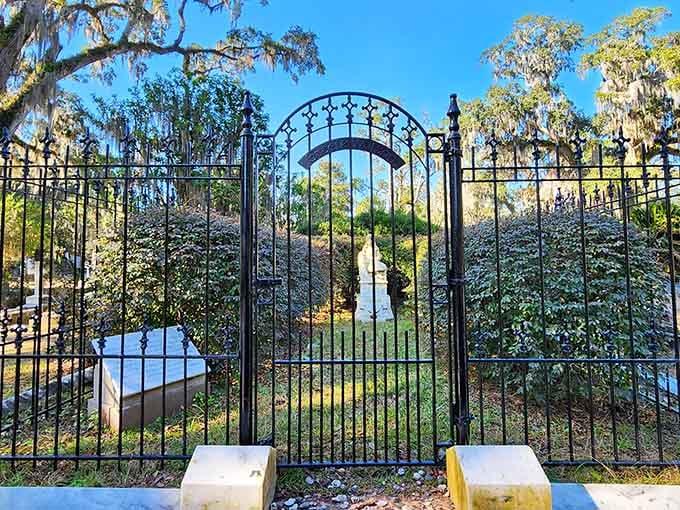 Iron gates that whisper "come in" while somehow also saying "you've been warned."