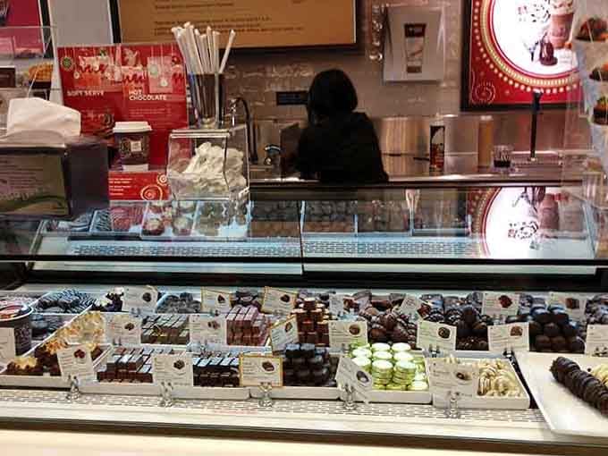 A display case full of Lindt truffles is basically a masterclass in temptation. Resistance is purely optional here.