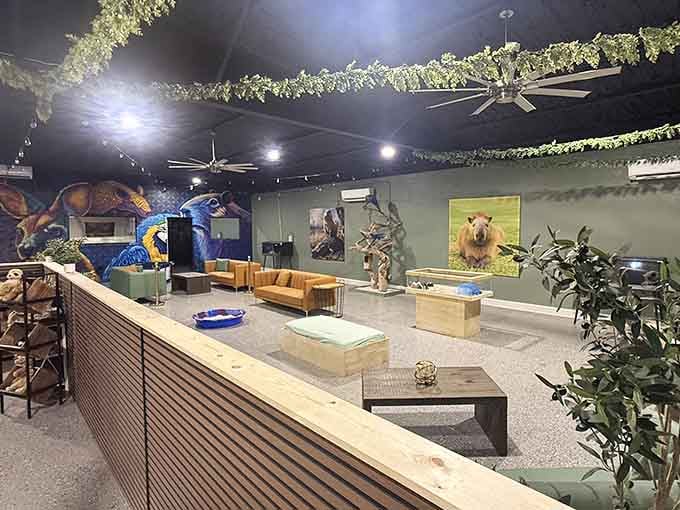 Trailing vines, warm lighting, and wildlife murals make this lounge feel like a very cool jungle retreat.