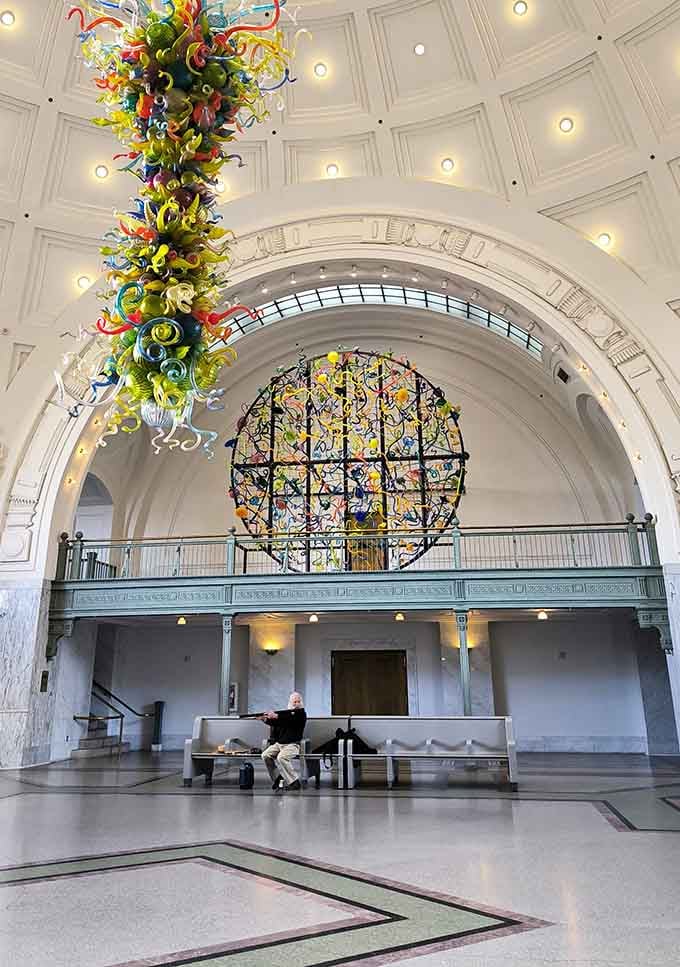Look up and lose yourself entirely, because that ceiling of swirling color demands your full attention.
