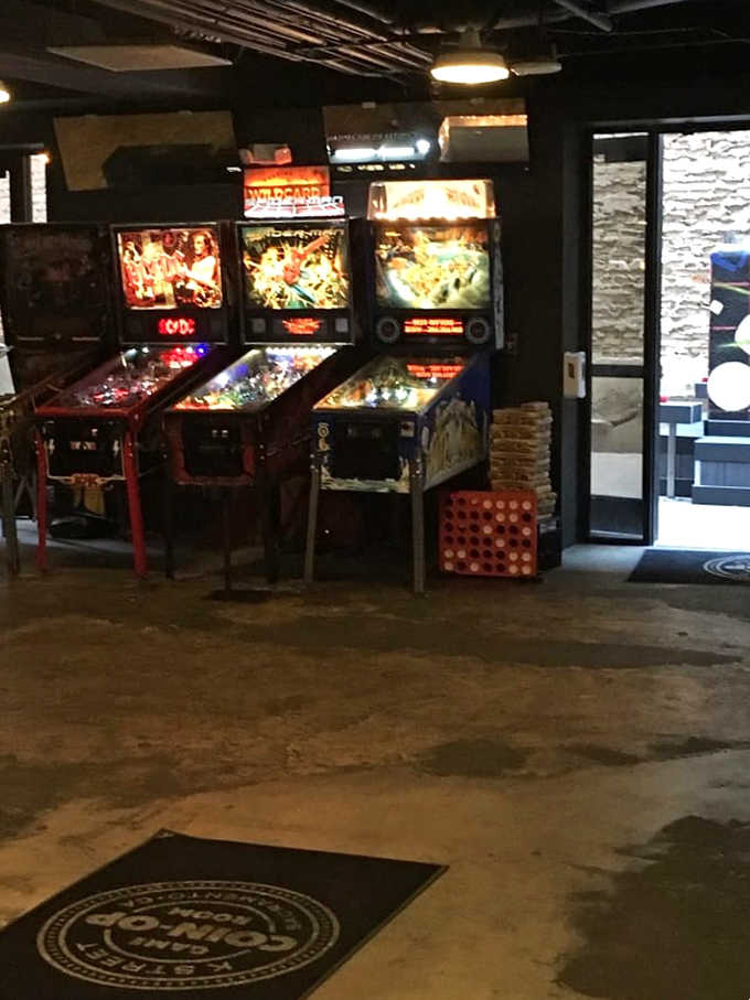 AC/DC, Spider-Man, and Wildcard machines lined up together, because apparently Coin-Op doesn't believe in playing favorites.