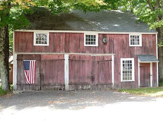 That weathered red barn with an American flag says everything about this town without uttering a single word.