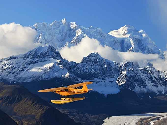When the mountains are this dramatic, even a yellow floatplane looks like it's showing off.