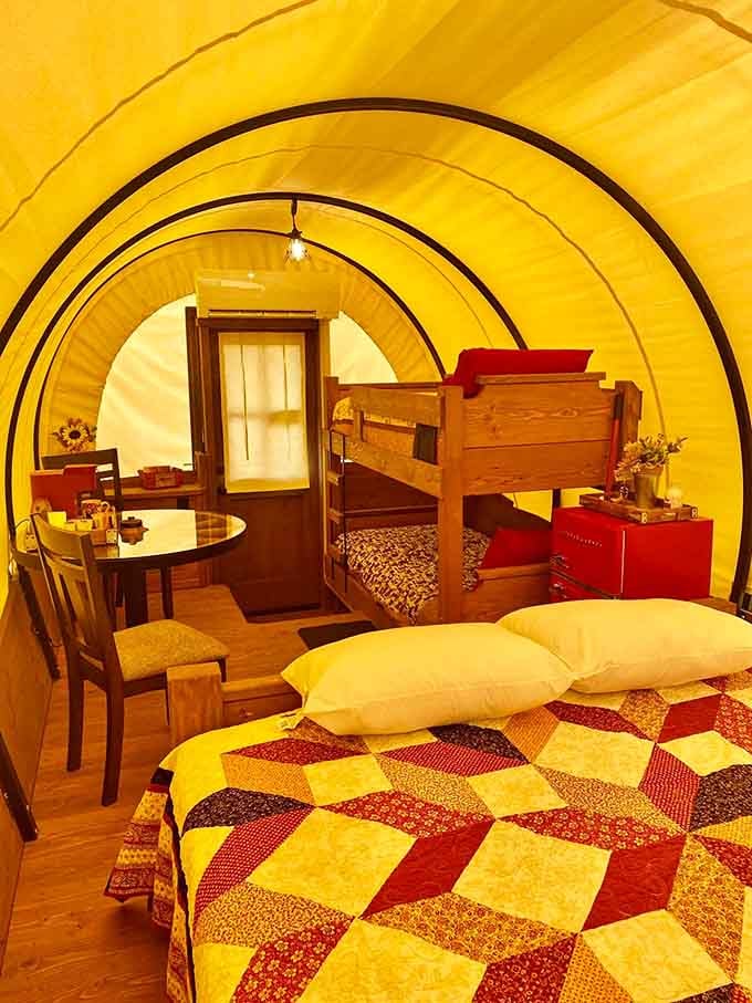 Warm golden walls, a patchwork quilt, and bunk beds. The frontier never looked this inviting.